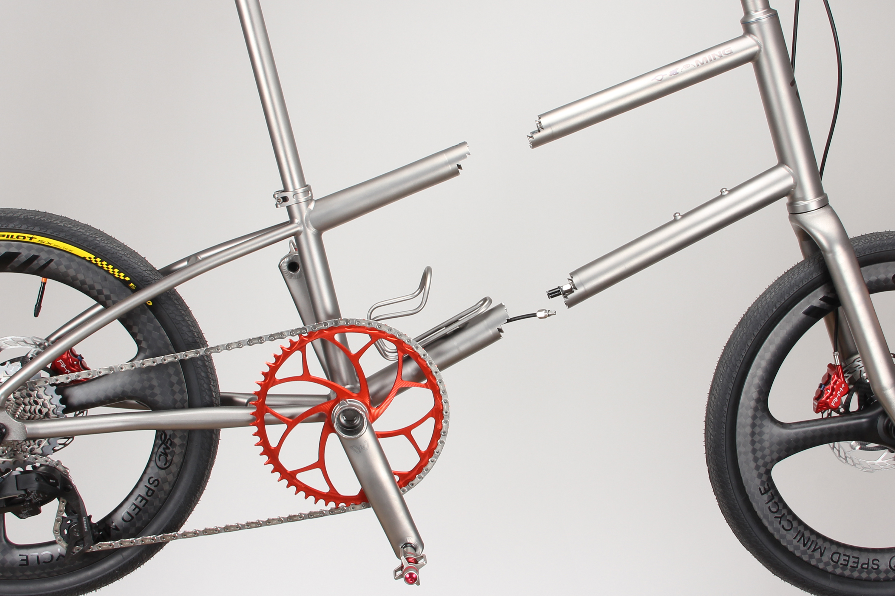 This Custom Titanium Firefly Mini Velo Fits in a Rimowa Case | The ...