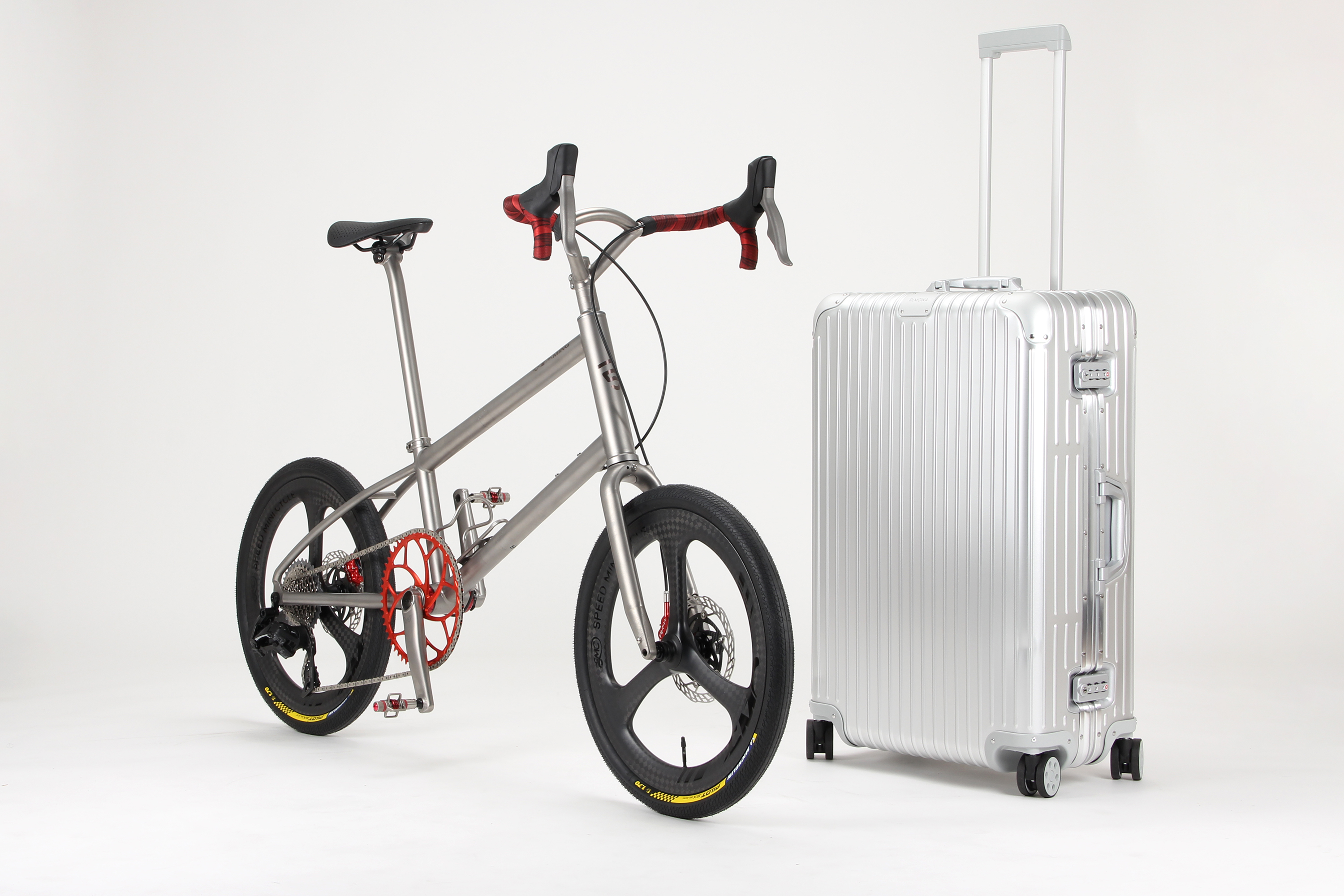 This Custom Titanium Firefly Mini Velo Fits in a Rimowa Case | The ...